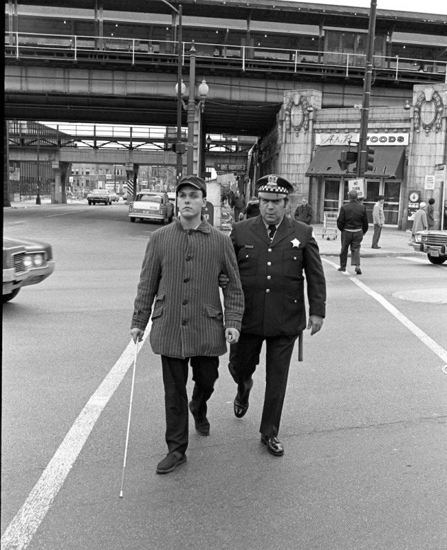 Cop Helping Blind Man - Bob Rehak Photography